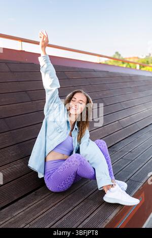 Young woman in stylish lilac t-shirt on white background Stock Photo ...