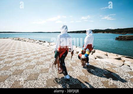 Japanese Ama divers wearing traditional attire near ocean Stock Photo ...