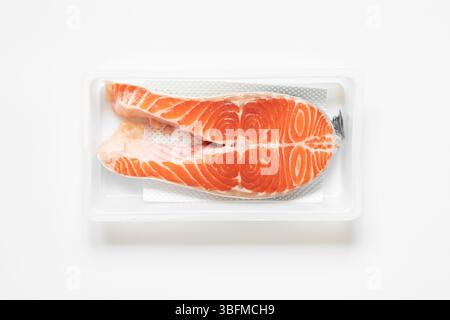 Salmon in plastic packaging on white background, chilled fish Stock ...