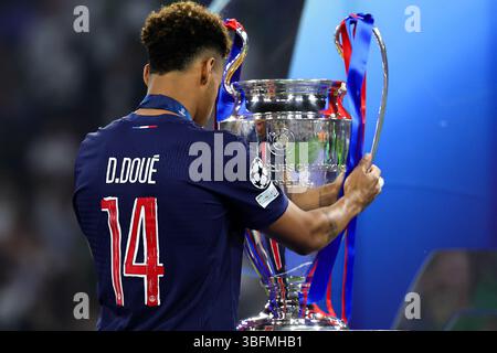Desire Doue of PSG celebrates with the trophy at the end of the 2024/ ...
