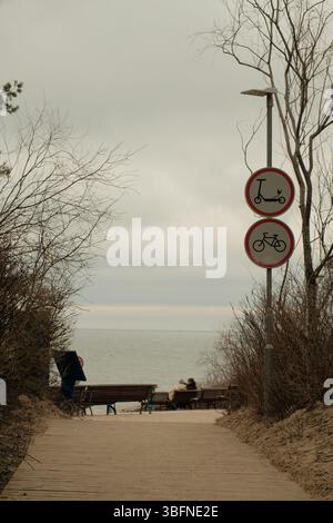 Public footpath sign point through a cow field Stock Photo - Alamy