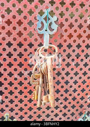 Holder with keys hanging on light wall Stock Photo - Alamy