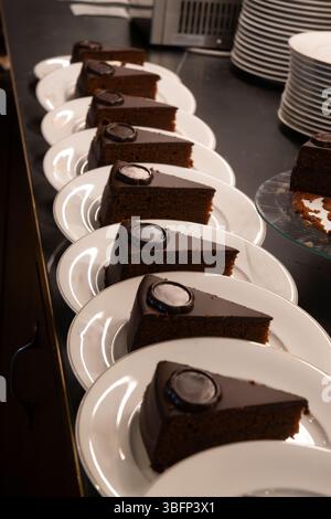 Plates with pieces of delicious apricot pie on color background Stock ...