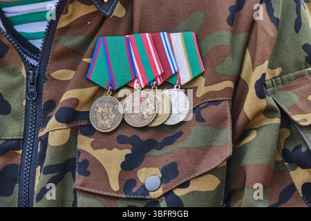 Jubilee medals of Russian and Soviet border troops on chest of former ...