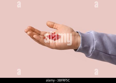 Closeup of male hand taking pink rose from a desk Stock Photo - Alamy
