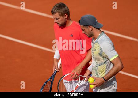 Lloyd Glasspool and Julian Cash during a doubles match the Rolex Paris ...