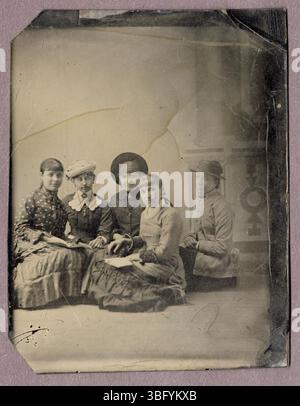 This photograph features a group of young women on an airplane in ...