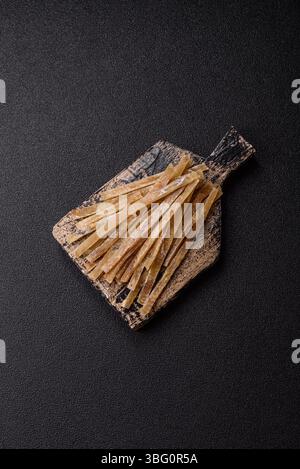 Food, snacks or jerky made from dried dehydrated salted fish with ...