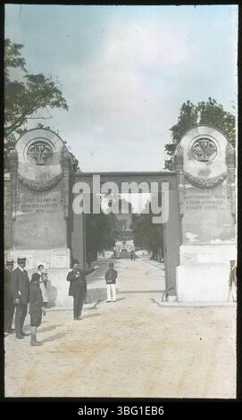 A man gestures toward the Père Lachaise Cemetery gate in Paris. The ...
