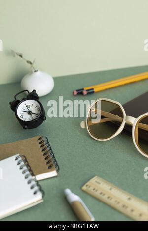 Green plant with laptop and stationery on grey table Stock Photo - Alamy