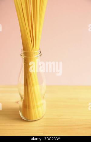 Spaghetti pasta in glass bottle. Uncooked italian pasta isolated on the ...