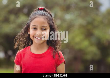 Hispanic girl wearing casual t shirt over yellow background smiling ...