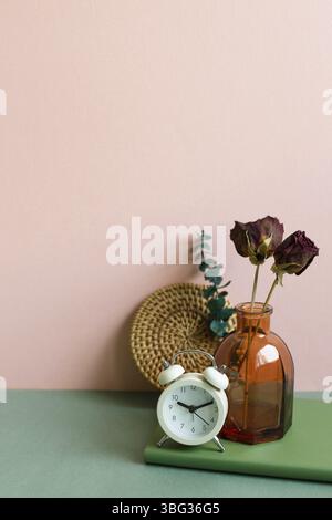 A pastel pink wall alarm clock on pink painted wall-Christmas Eve or ...