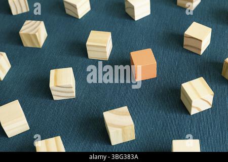 Group of wooden blocks and one different block. Different opinion ...