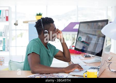 Office desk with headset and supplies. Remote office and work from home ...