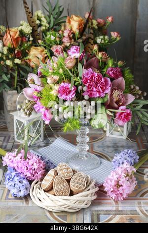 Easter gingerbread cookies and floral arrangement with orchids ...