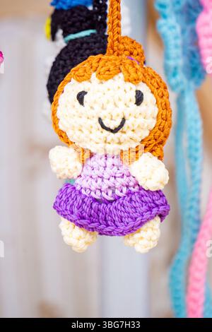 Creative keyring or key chain made of spring daisy flower. Minimal safe ...