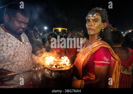 The parade ends in the beach of Kulasai village. The devotees are ...