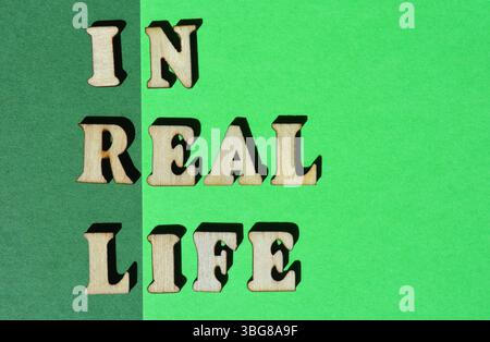 IRL, acronym for In Real Life, in wooden alphabet letters isolated on ...