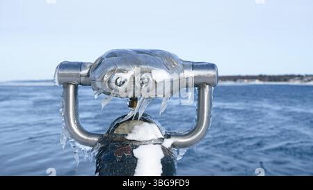 Frozen View Through a Public Telescope Sights Overlooking Icy Lake ...