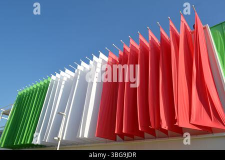 National flag of Italy made of giant folded pieces of fabric of green ...