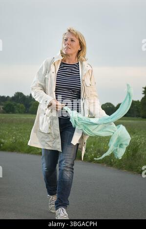 Full body shot of happy mature woman in bikini ready for vacation Stock ...
