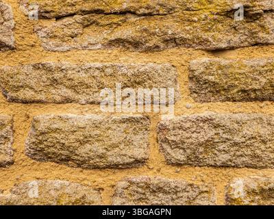 Lime pointing a stone wall. A section of stone wall partly re-pointed ...