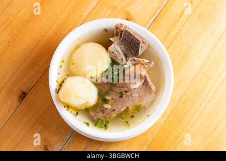 Beef rib broth with potatoes and cilantro - Traditional Colombian food ...