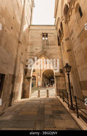 Modena, Italy 1 January 2025: Stone archway leading to a courtyard in ...