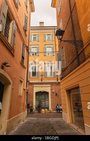 Modena, Italy 1 January 2025: Tourists walking in a narrow street in ...
