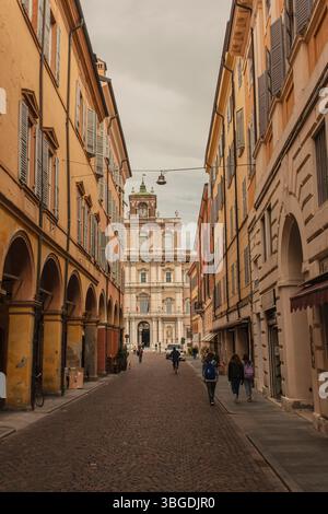 Modena, Italy 1 January 2025: Tourists walking under an arch in modena ...