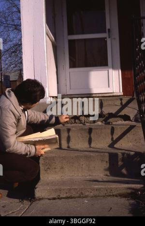A male inspector examines the deterioration of a concrete step on a ...