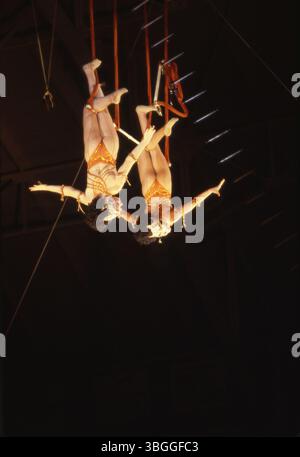 Two female trapeze artists from the Flying Espanas troupe perform an ...