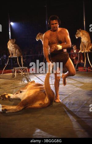 Tarzan Zerbini performs with his trained lions during the 29th annual ...