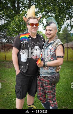 A gay couple with high Mohawk hairdos share a kiss at the New Paltz ...