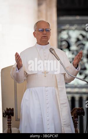 Pope Leo XIV delivers his blessing as he recites the Angelus noon ...
