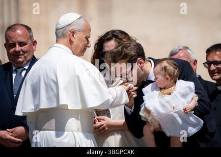 Pope Leo XIV delivers his blessing as he arrives at Pavia's Cathedral ...