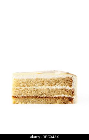 A slice of vanilla layered cake with whipped frosting and colorful ...
