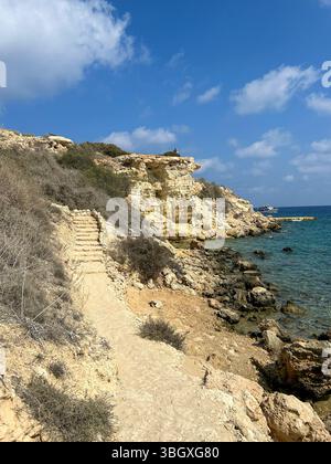 Coastal Trail Overlooking Clear Blue Ocean and Rugged Green Shoreline ...