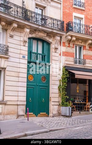 Tall beige and brown residential apartment buildings under a cloudy sky ...