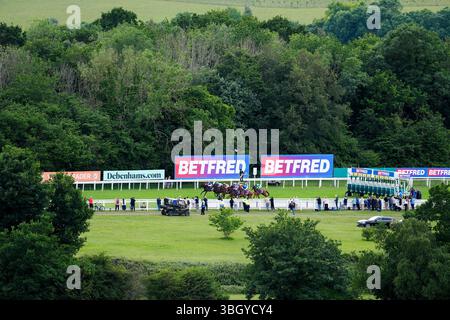 Runners and riders at the start of the Betfred Oaks at Epsom Downs ...
