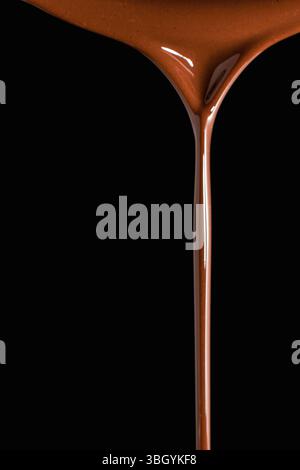 Pouring stream of milk chocolate Stock Photo - Alamy