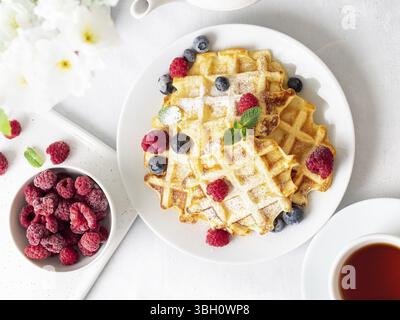 Homemade curd dessert. Fruit tea, fresh strawberries, mint leaves and ...