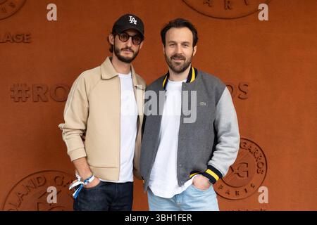 Pierre Niney and Antoine Gouy take a pose at Roland Garros for the ...