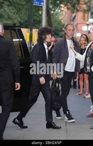 Miley Cyrus and Maxx Morando arriving to the world premiere of “Avatar ...