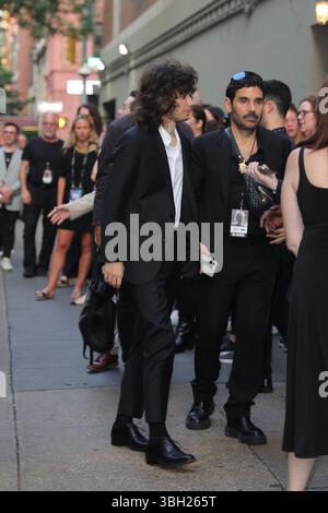 Miley Cyrus and Maxx Morando arriving to the world premiere of “Avatar ...