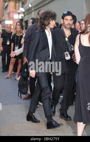 Miley Cyrus and Maxx Morando arriving to the world premiere of “Avatar ...