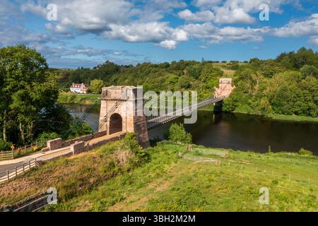 Summer and the newly restored Union Chain Bridge spans the River Tweed ...