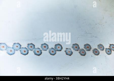 Contact welding marks on a sheet of metal close-up Stock Photo - Alamy