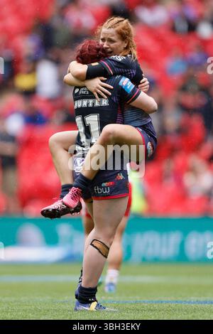 Grace Banks of Wigan Warriors Women races for the line to score in the ...